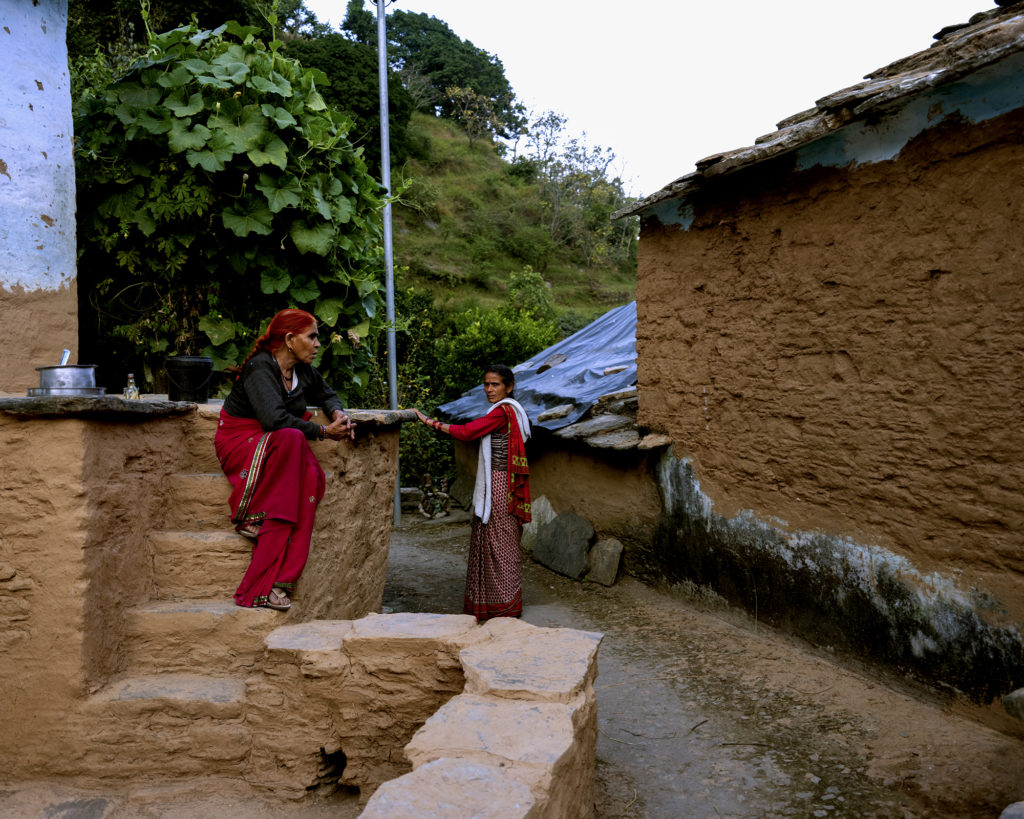 women chatting, Sheela Village | Aperture